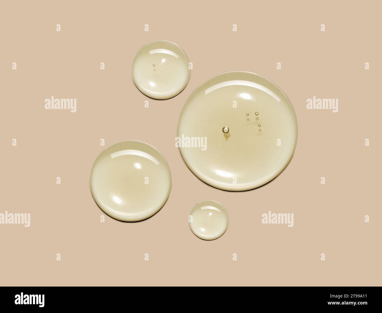 Yellow serum oil sample swatch round shape texture isolated on beige ...