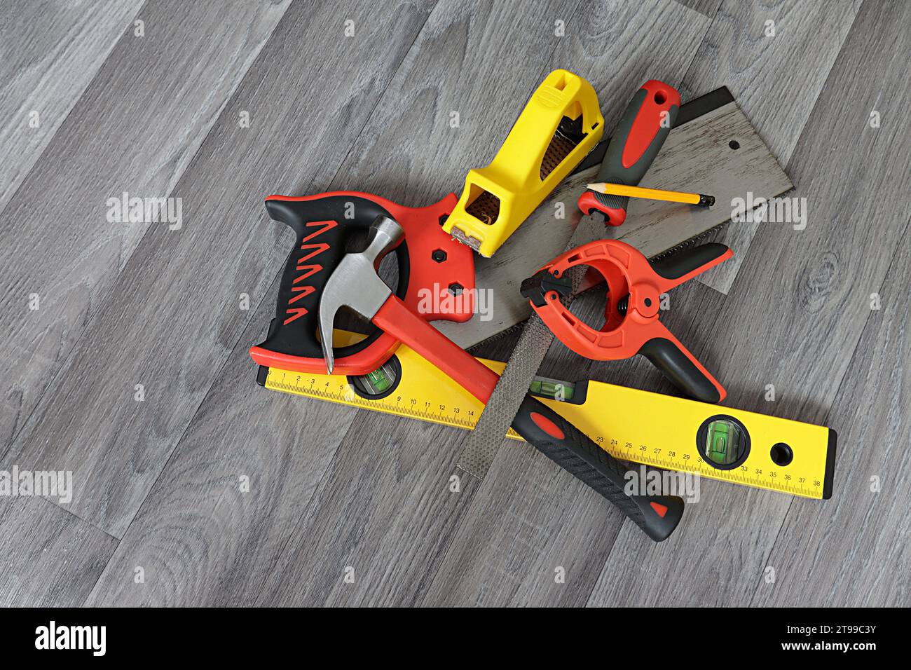 Carpentry tools, saw, spirit level, file, hammer, pencil, spring clamp ...