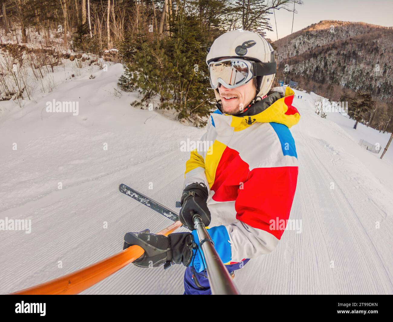 A daring man conquers snowy slopes with style, showcasing skill and ...