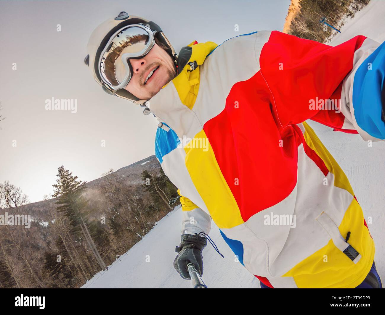 A daring man conquers snowy slopes with style, showcasing skill and ...