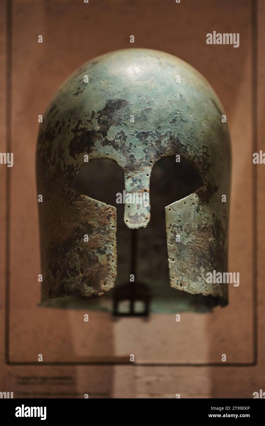 Ancient bronze helmet in the Louvre Museum in Paris, France Stock Photo ...