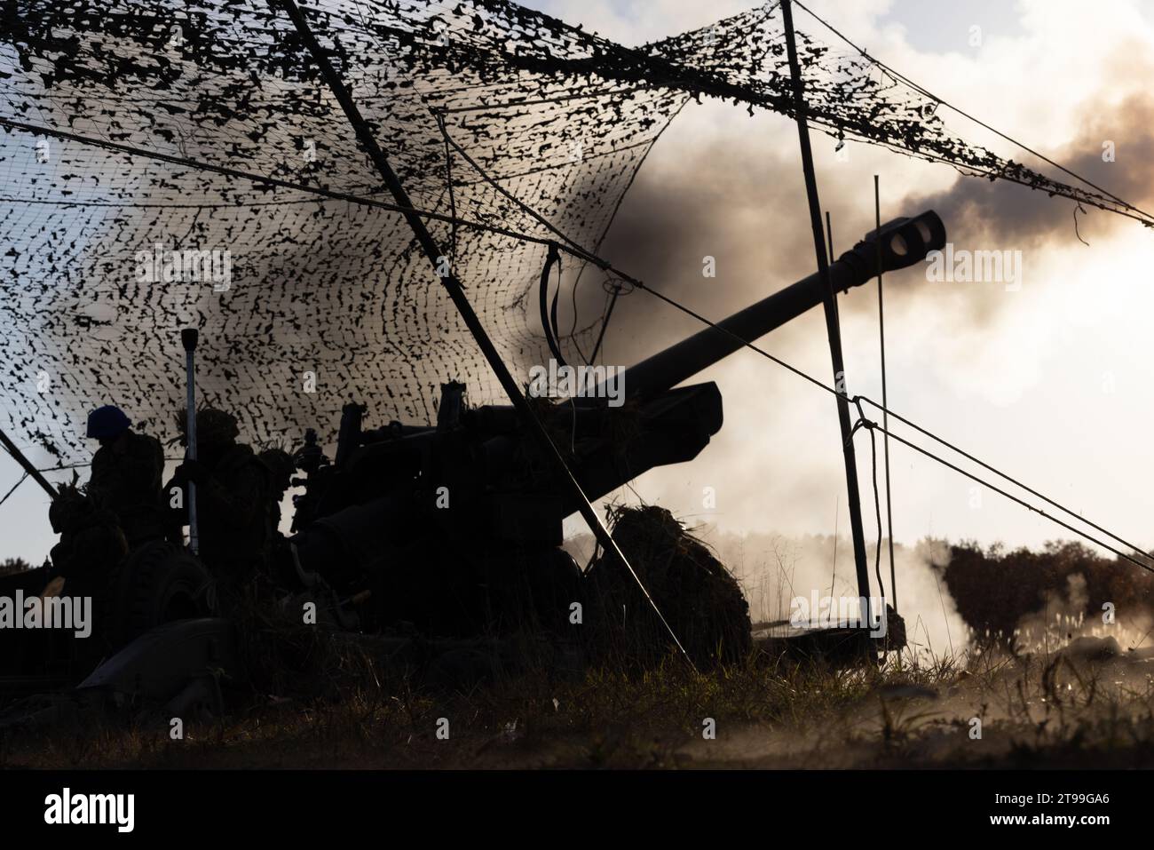 Japan Ground Self-Defense Force service members fire a FH-70 during the ...