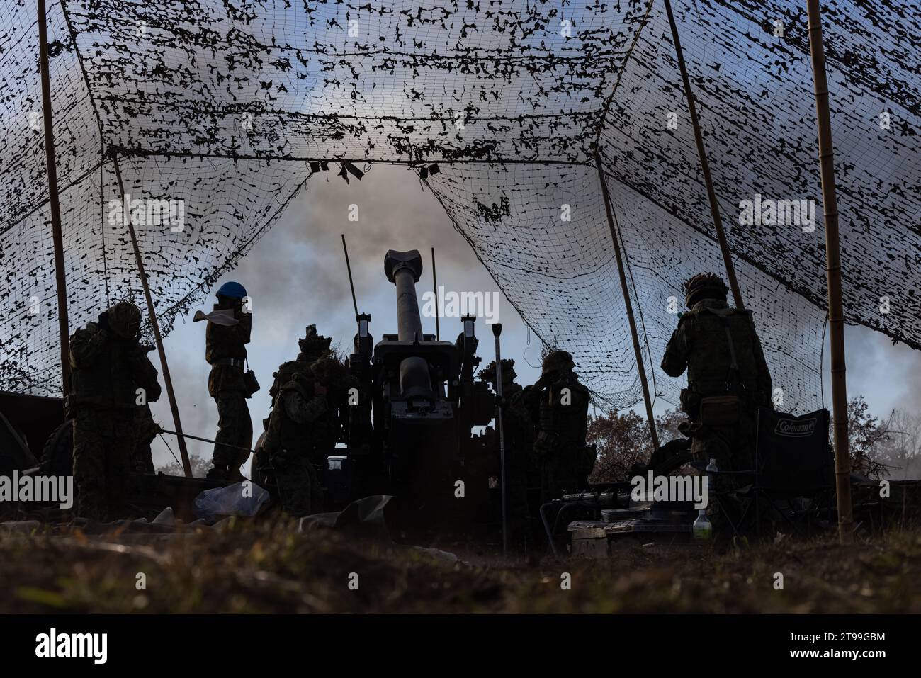Japan Ground Self-Defense Force service members fire a FH-70 during the ...