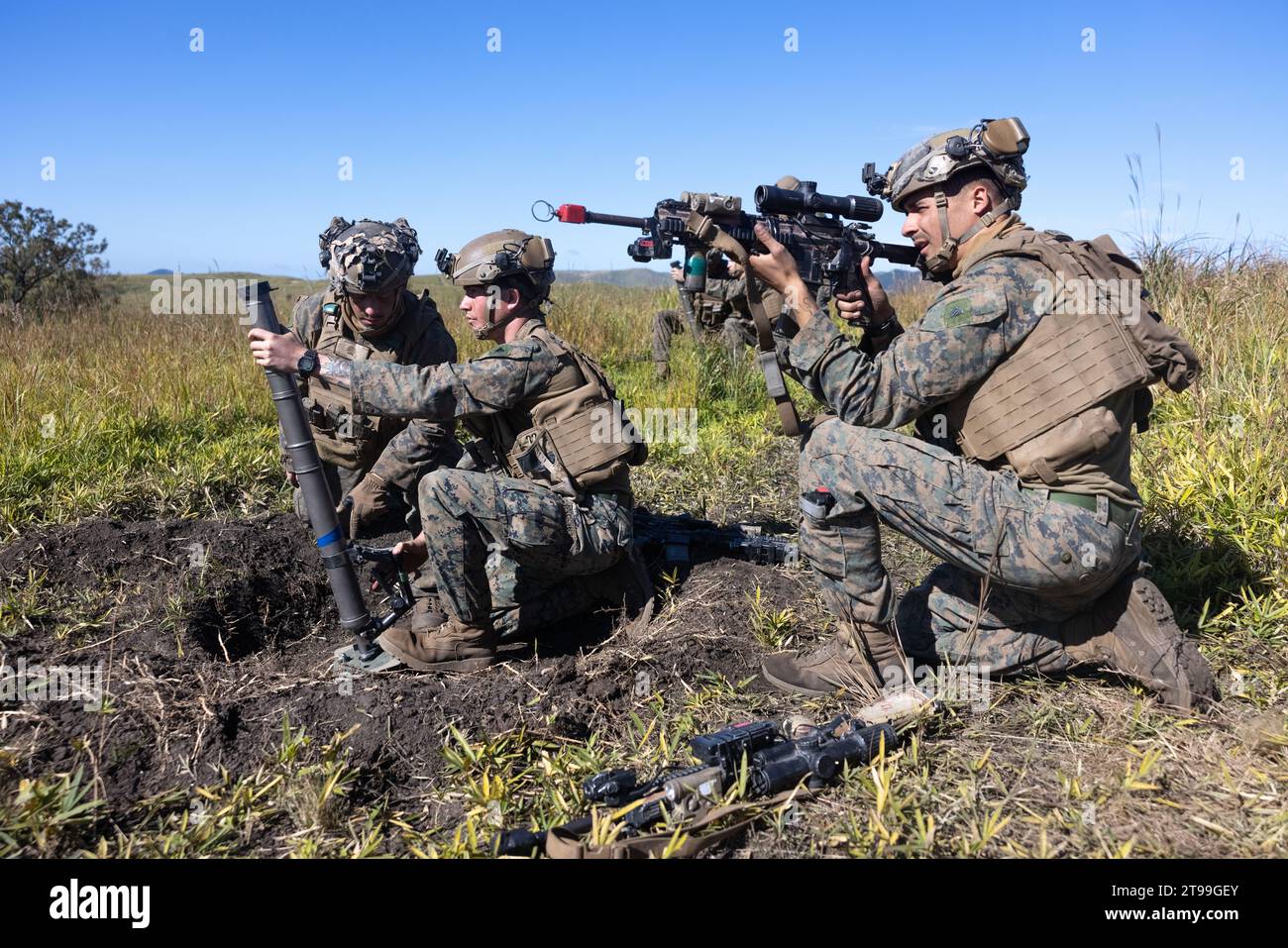 U.S. Marines with 2nd Battalion, 2nd Marine Regiment, lay down ...