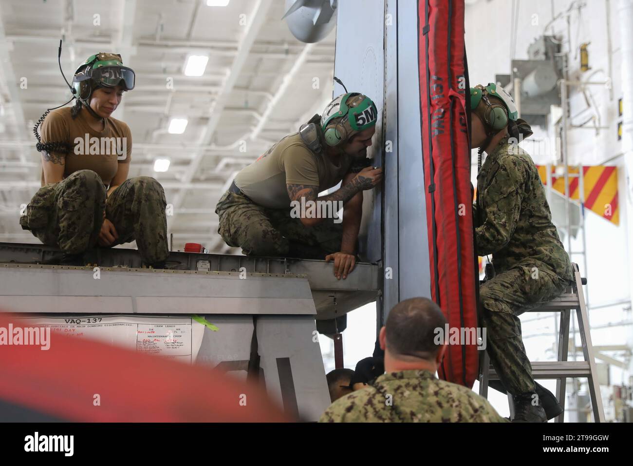 SAN DIEGO (Nov. 18, 2023) U.S. Sailors conduct maintenance on an EA-18G ...