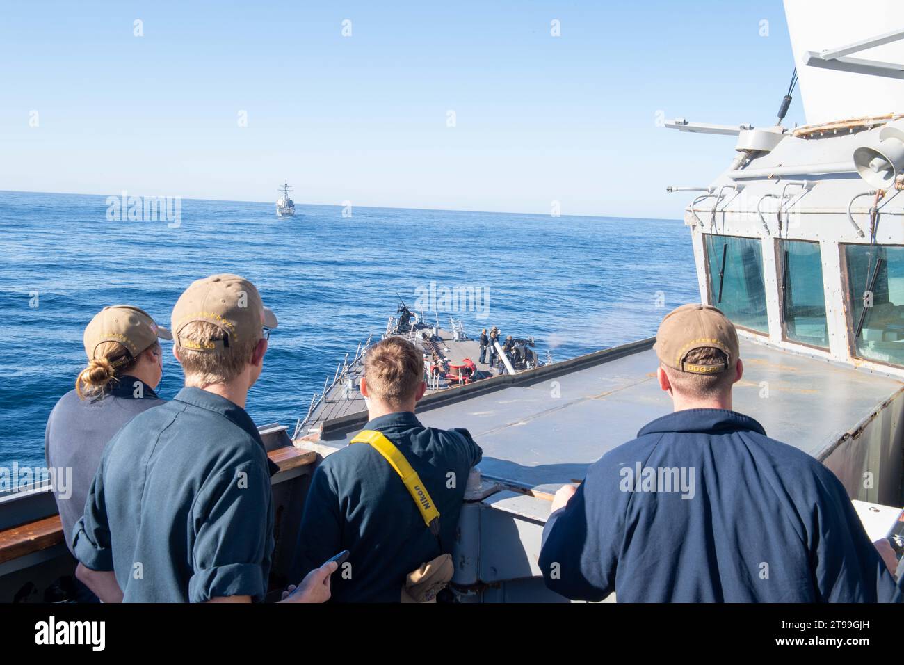 PACIFIC OCEAN (Nov. 20, 2023) U.S. Sailors monitor a gun shoot from the ...