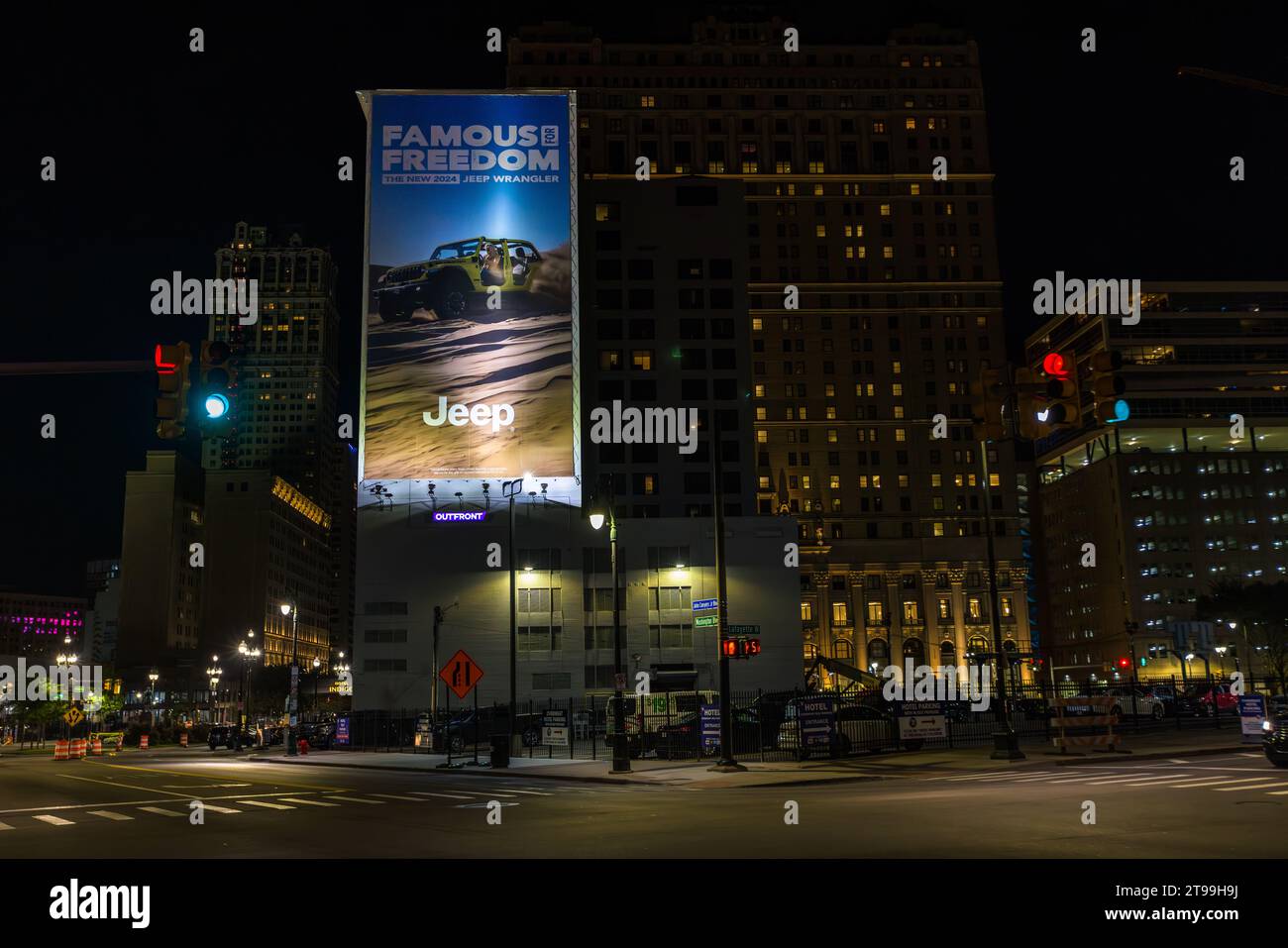 Night scene at a Detroit intersection with a huge illuminated ...