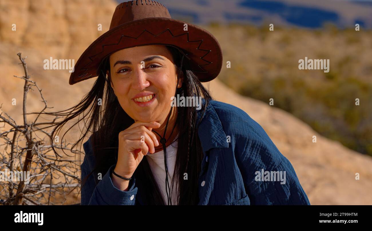 Close up shot of a young woman in a western style outfit in the Arizona ...