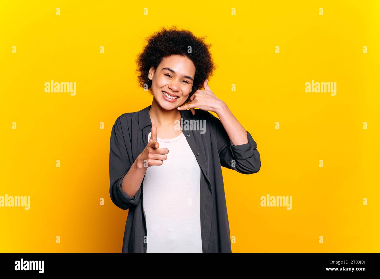 Phone call. Positive african american or brazilian curly woman, showing ...