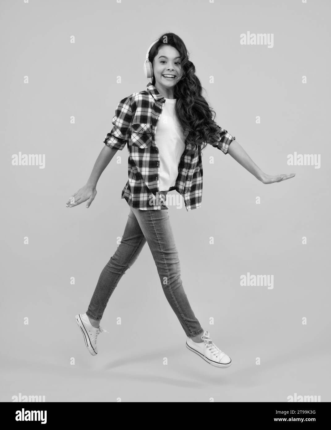 Child music concept. Teenager child girl dances in rhythm of melody ...