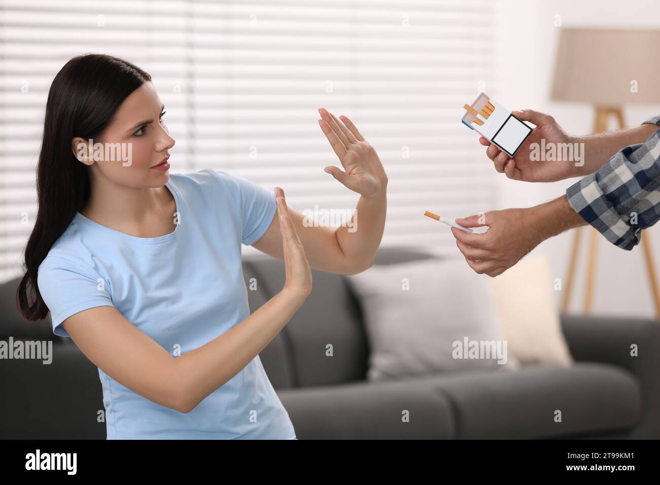Stop smoking concept. Woman refusing cigarettes indoors Stock Photo - Alamy