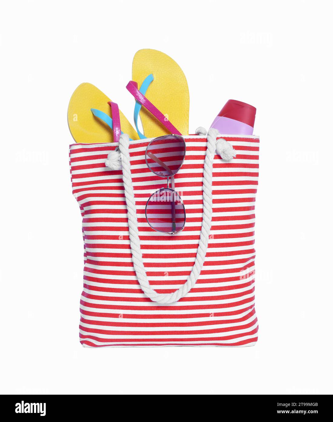 Beach bag with sunglasses, sunscreen and flip flops isolated on white ...