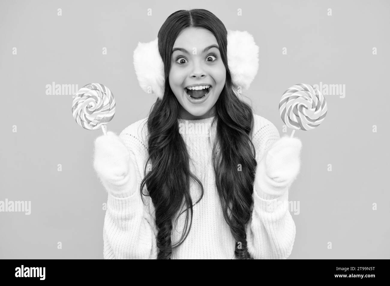 Excited teenager girl with caramel candies on sticks, sweet sugar ...