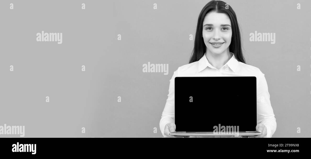 Woman isolated face portrait, banner with mock up copy space. woman showing laptop screen ...