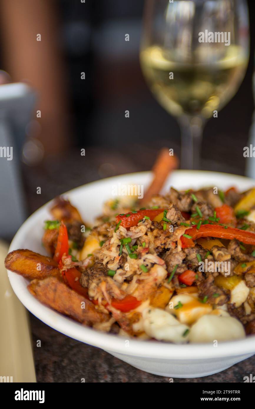 Italian style poutine served with wine Stock Photo - Alamy