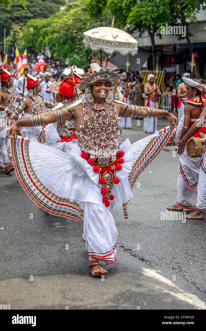 An Up Country or Kandyan Dancer performs along the streets of Kandy in ...