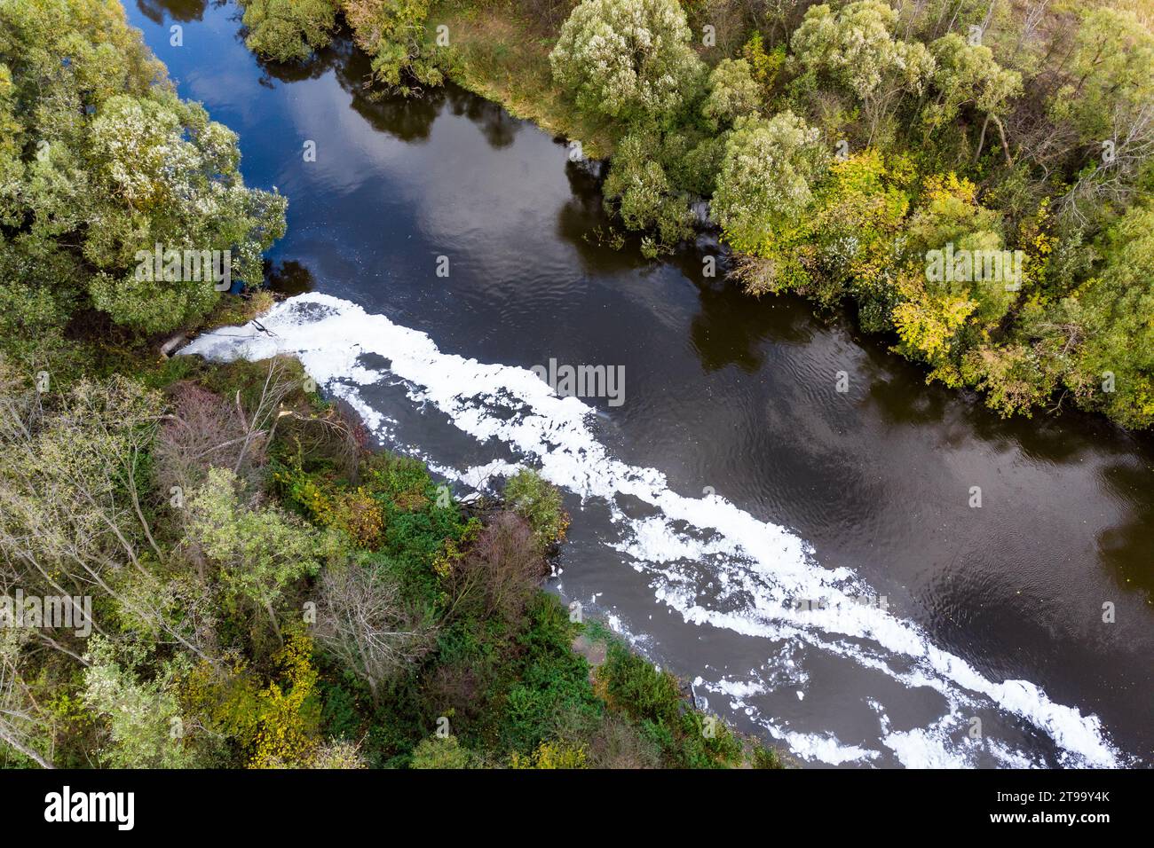 Aerial view of foam in the river at the site of wastewater treatment ...