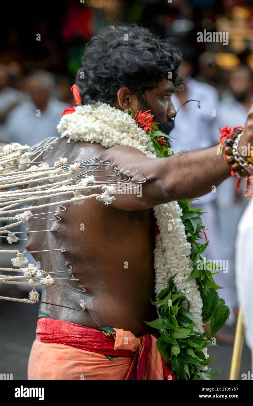 A Hindu Kavadi Dancer with hooks piercing their skin on his back ...