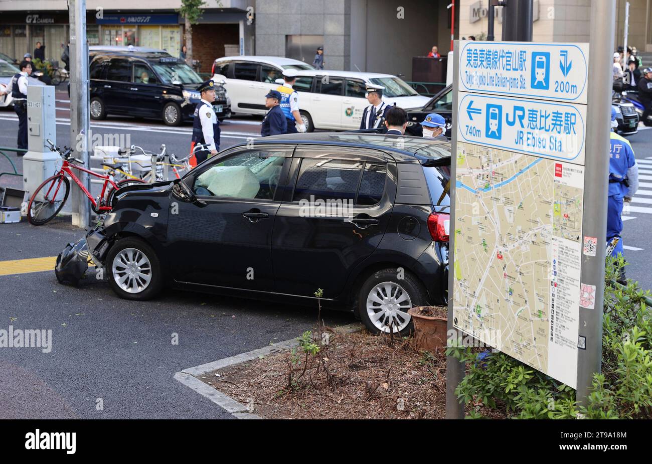 A photo shows an accident scene where a car collided with a guardrail ...