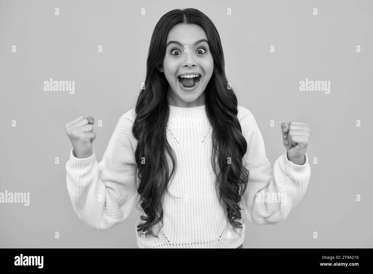 Excited expression, cheerful and glad. Teenager child doing winner ...