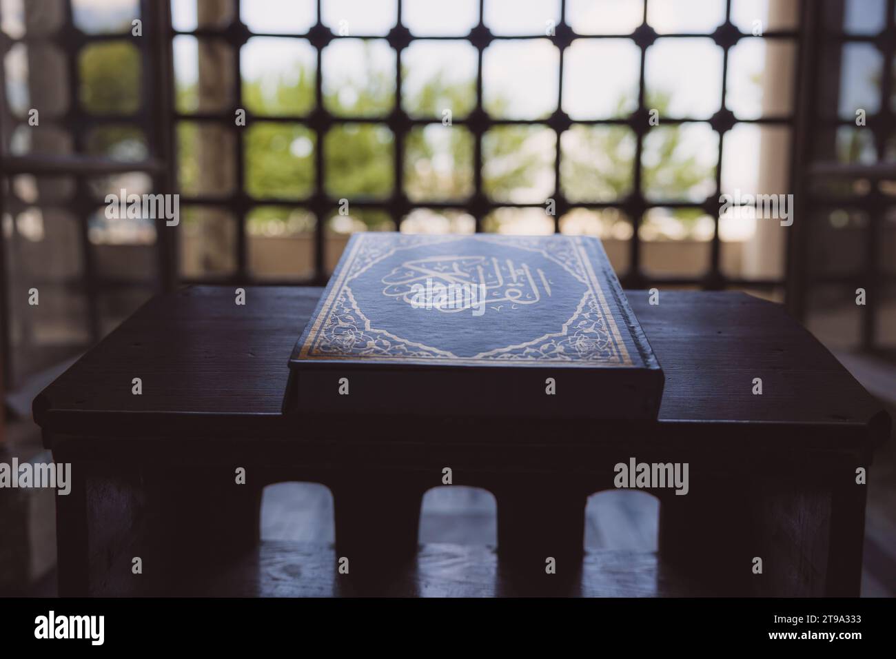 Islamic or ramadan background photo. The Holy Quran on the book stand ...
