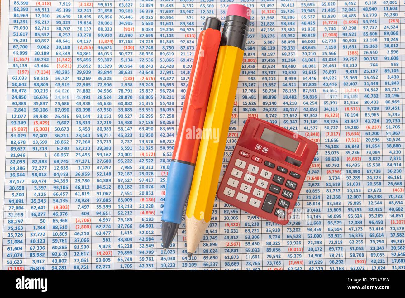 Giant Pencil and Pen with Calculator on Spreadsheet Stock Photo - Alamy