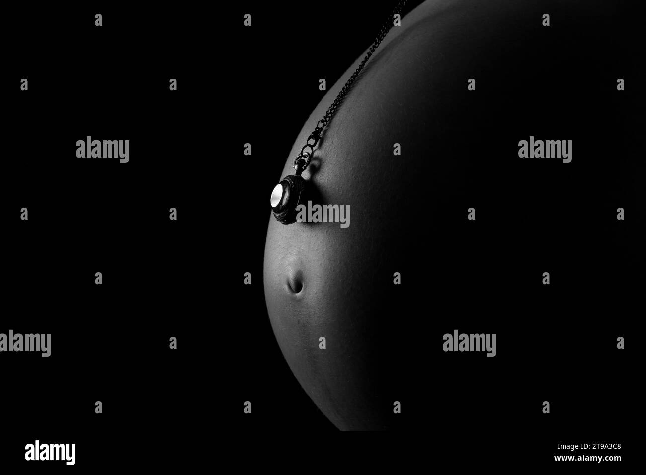 Pendant on a pregnant belly hi-res stock photography and images - Alamy