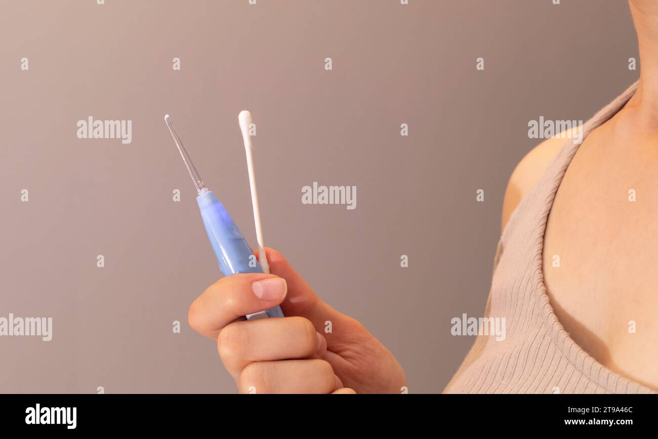 Person Holds Ear Wax Removal Glass Stick Or Curette With Led Light And ...