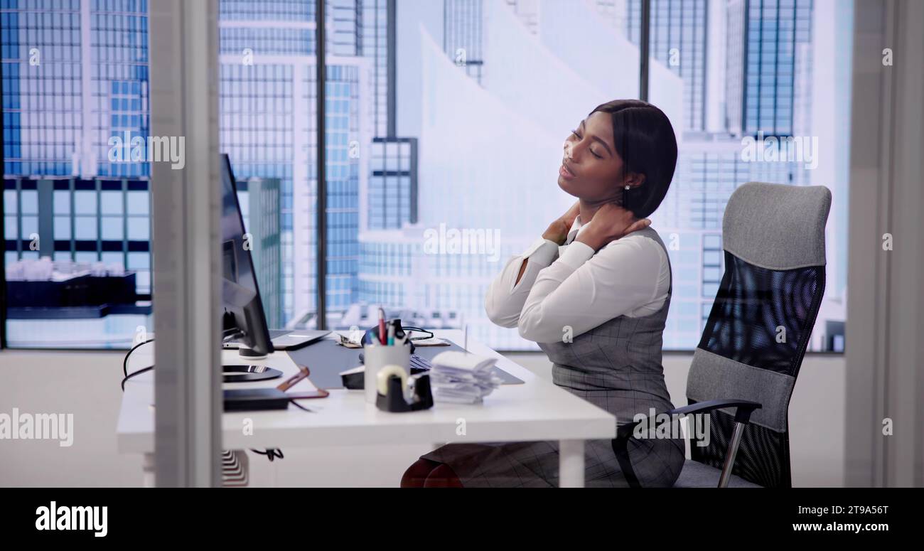 Improving Office Ergonomics: Woman Corrects Bad Posture Stock Photo - Alamy