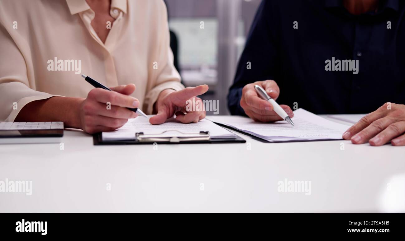 Professional woman reviewing documents hi-res stock photography and ...