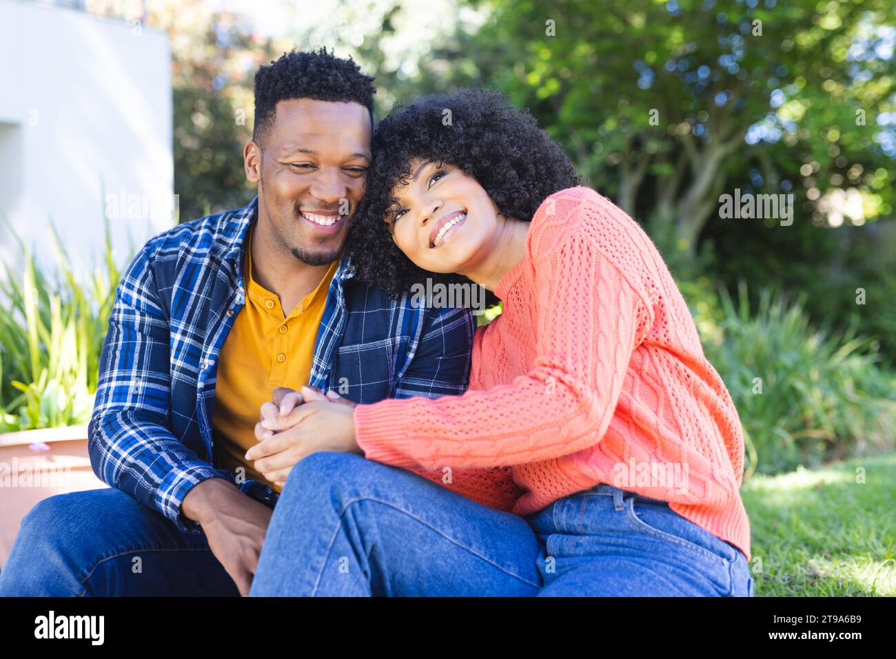 Happy African American Couple Embracing And Holding Hands On Stairs In