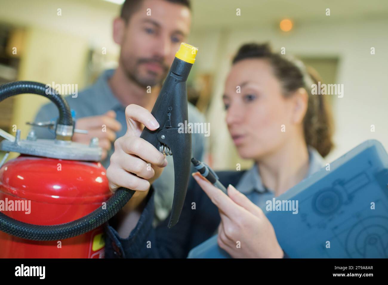 woman showing object to a man Stock Photo - Alamy