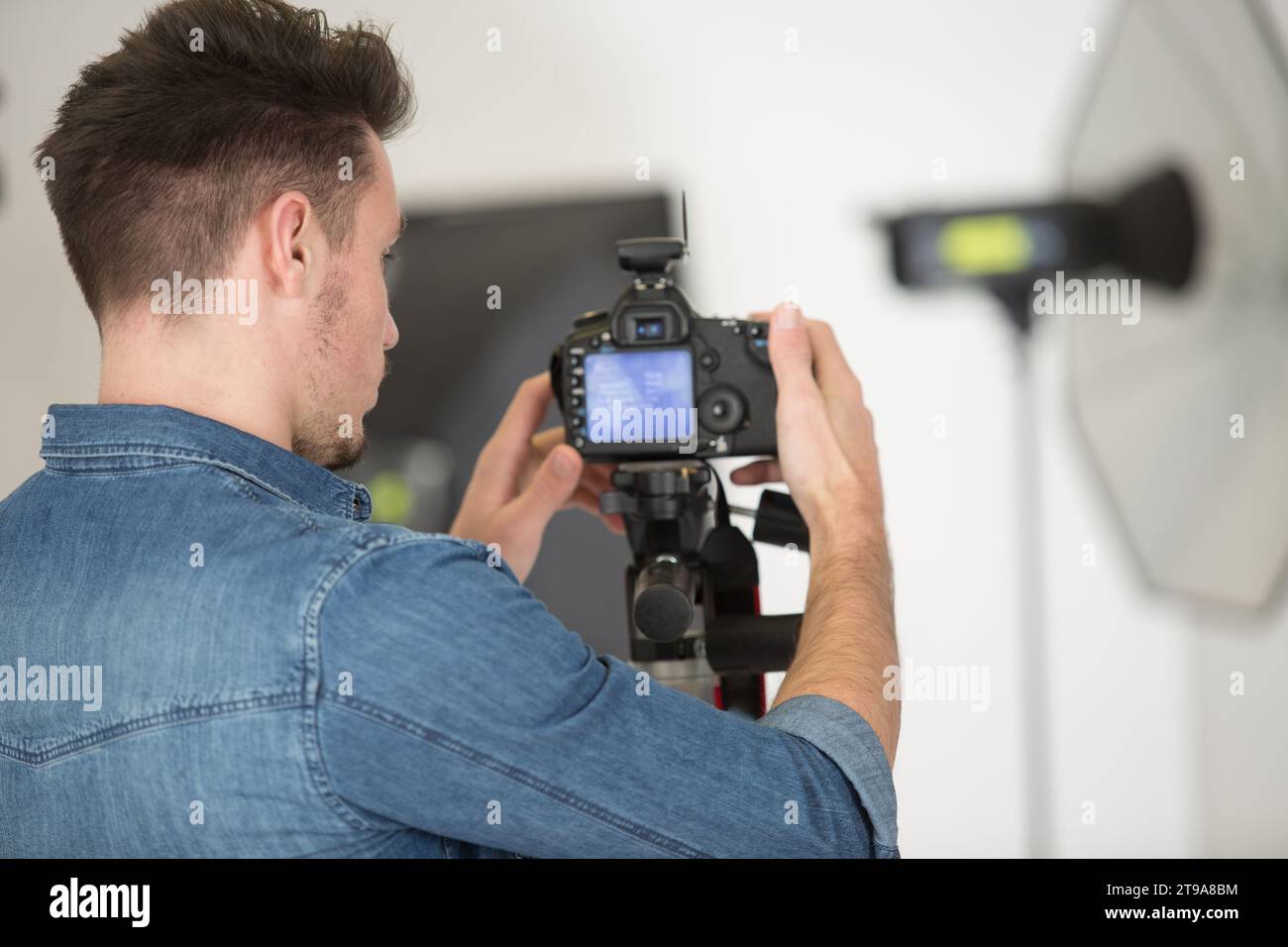 photographer shooting model in studio with softboxes Stock Photo - Alamy