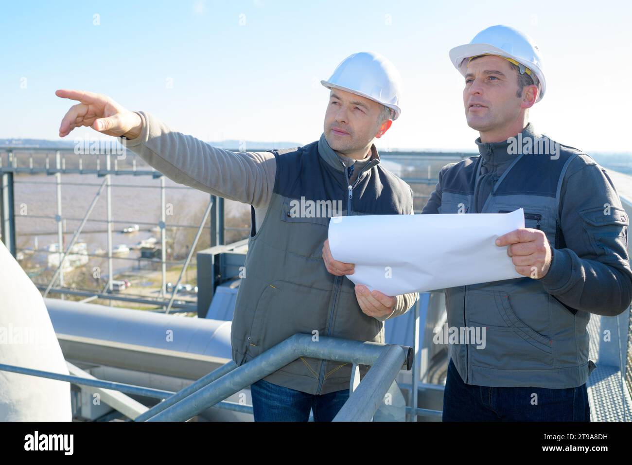 worker with manager inspecting industrial area Stock Photo - Alamy