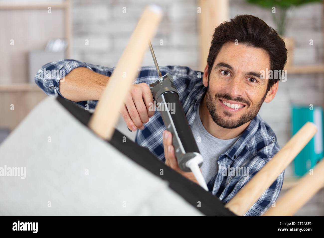 Man repair armchair hi-res stock photography and images - Alamy