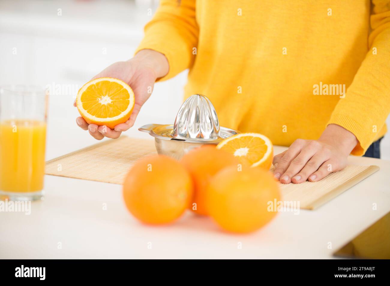 Woman making orange juice close hi-res stock photography and images - Alamy