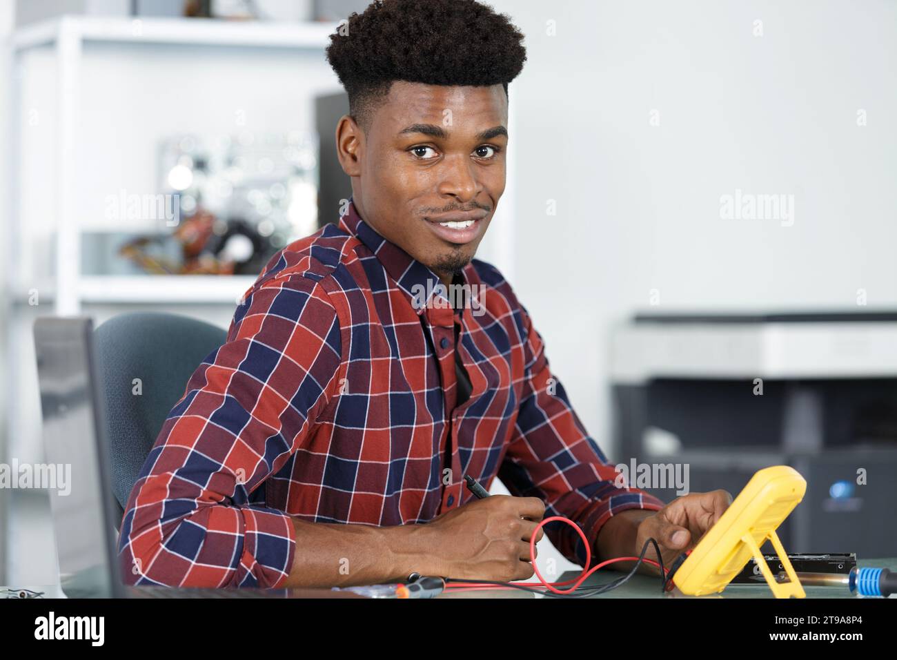 male technician using voltage meter Stock Photo - Alamy