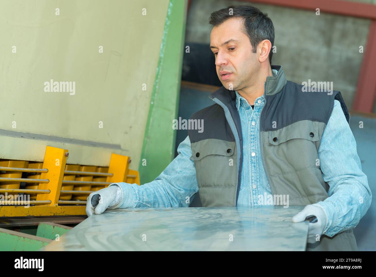 man holding panel of glass Stock Photo - Alamy