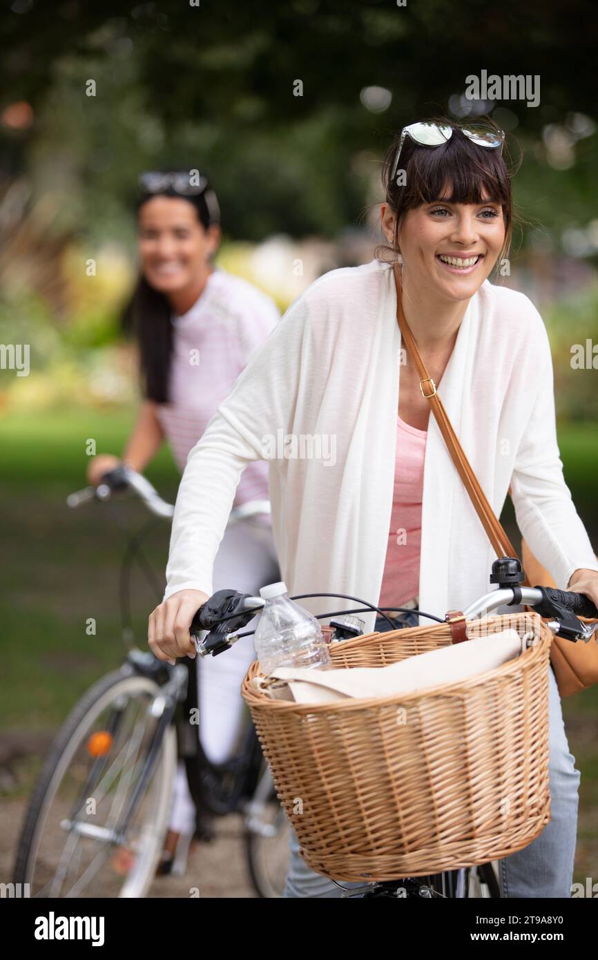two women enjoying a cycle ride Stock Photo - Alamy