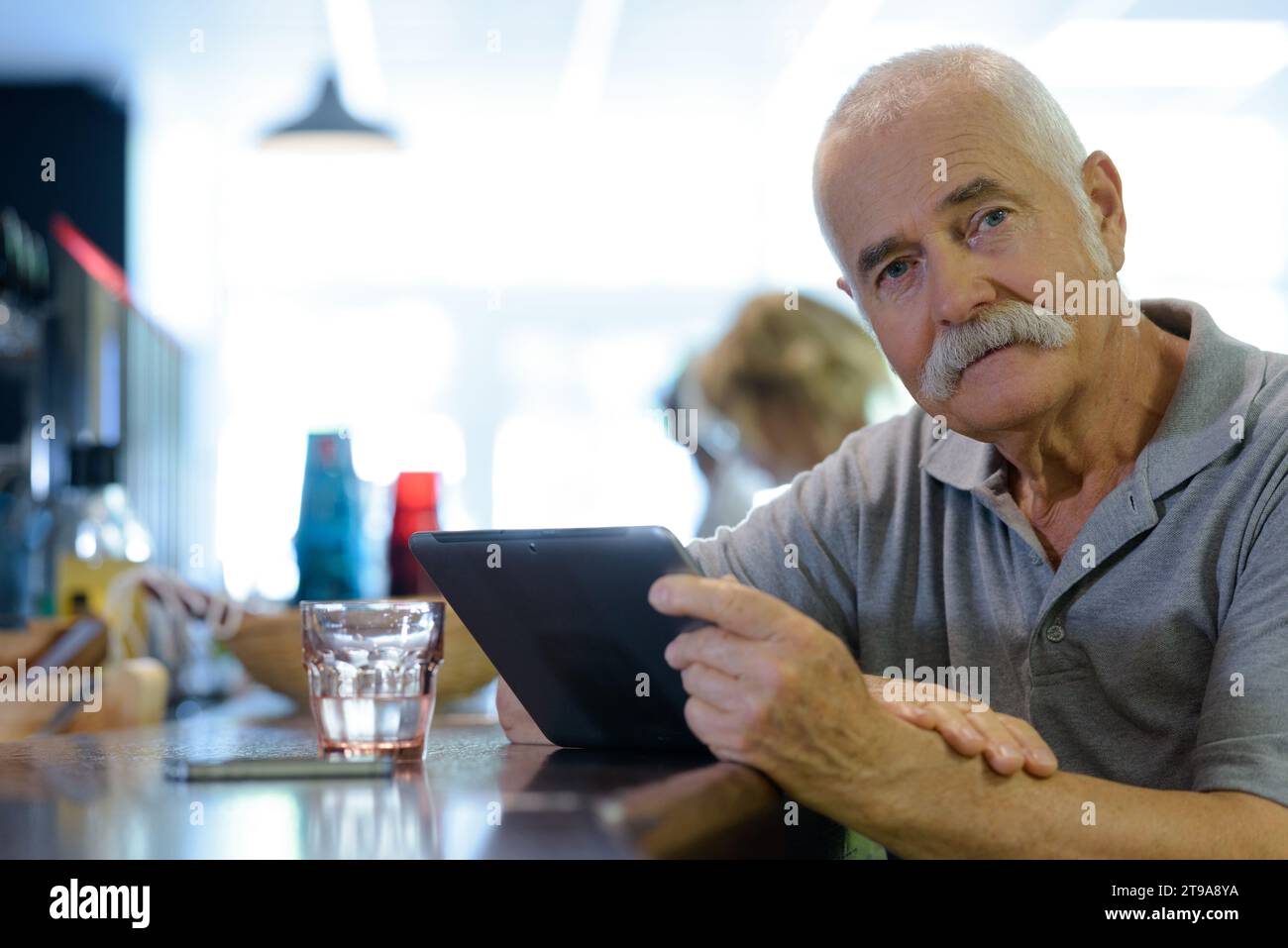 senior man in a bar alone Stock Photo - Alamy