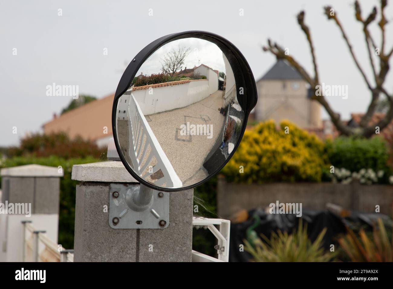 Traffic safety convex mirror near exit home portal on the street Stock ...