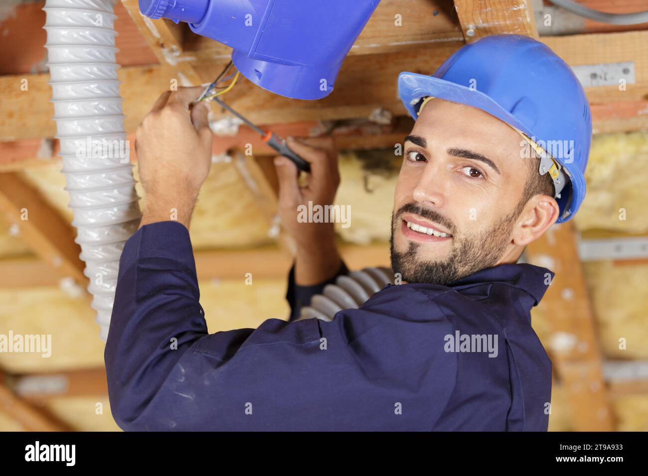 portrait of builder connecting wires on hvac unit Stock Photo - Alamy