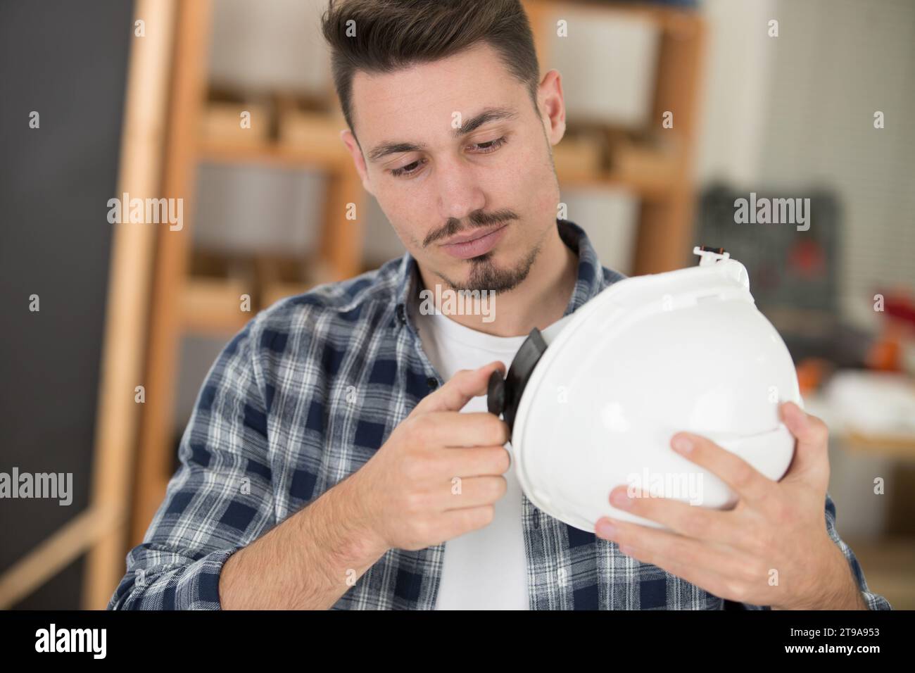Engineer putting on helmet hi-res stock photography and images - Alamy