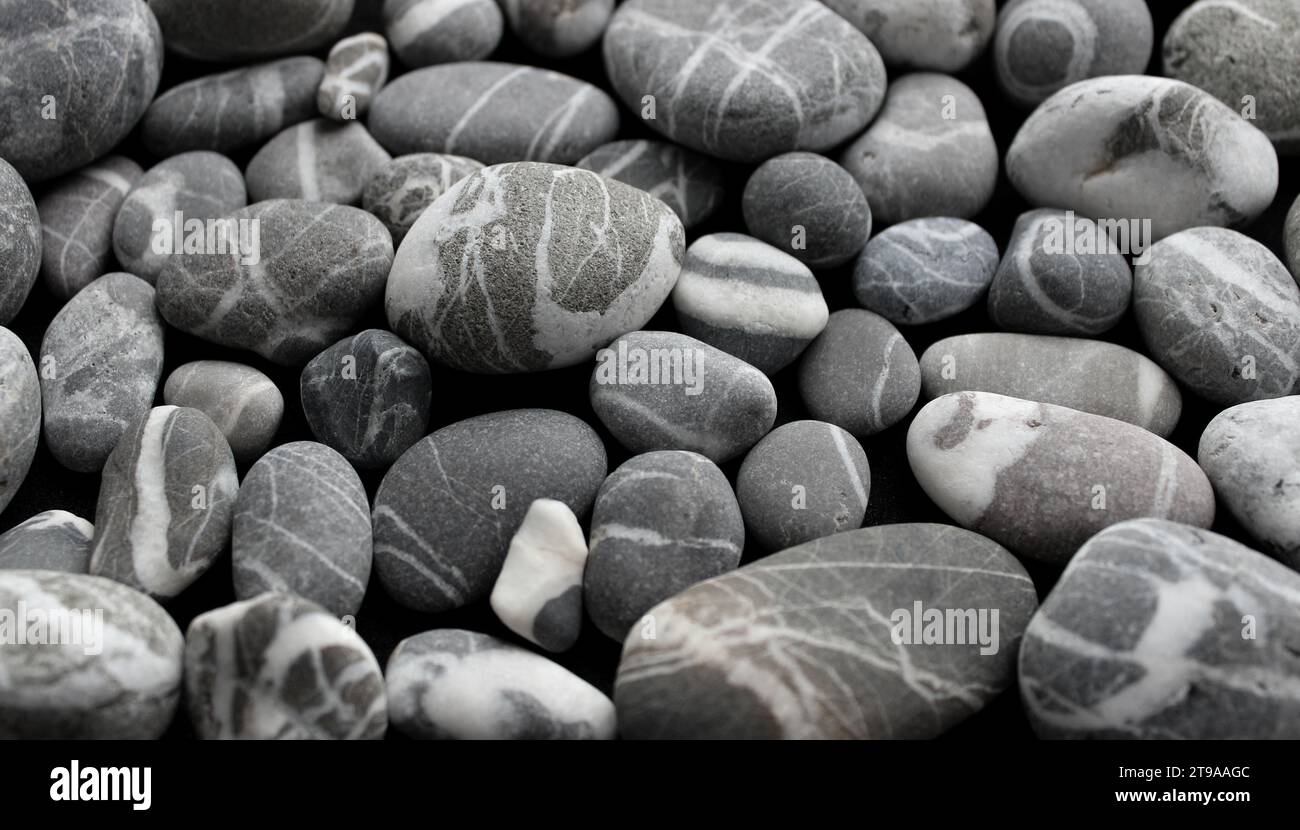 Pile granite pebbles marked with white quartz veins hi-res stock photo Stock Photo - Alamy