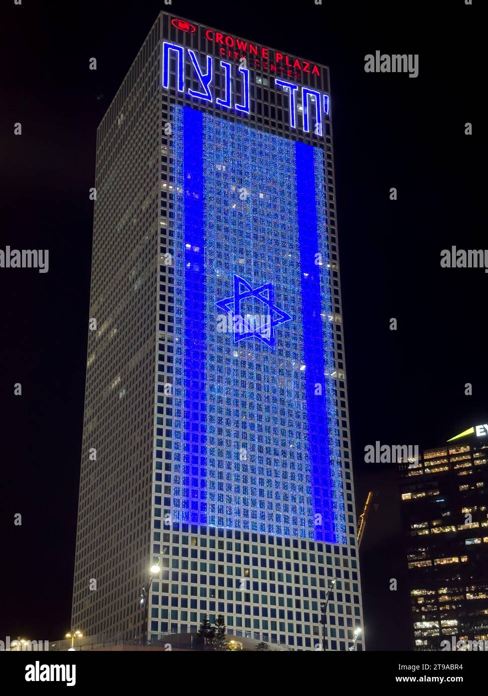 An illuminated sign shows the Israeli national flag and a text that ...