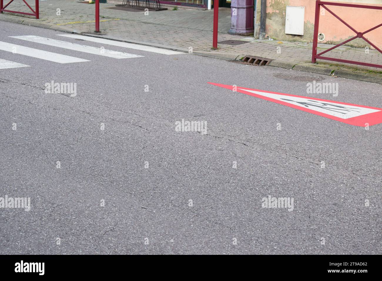 crosswalk with a warning sign Stock Photo - Alamy