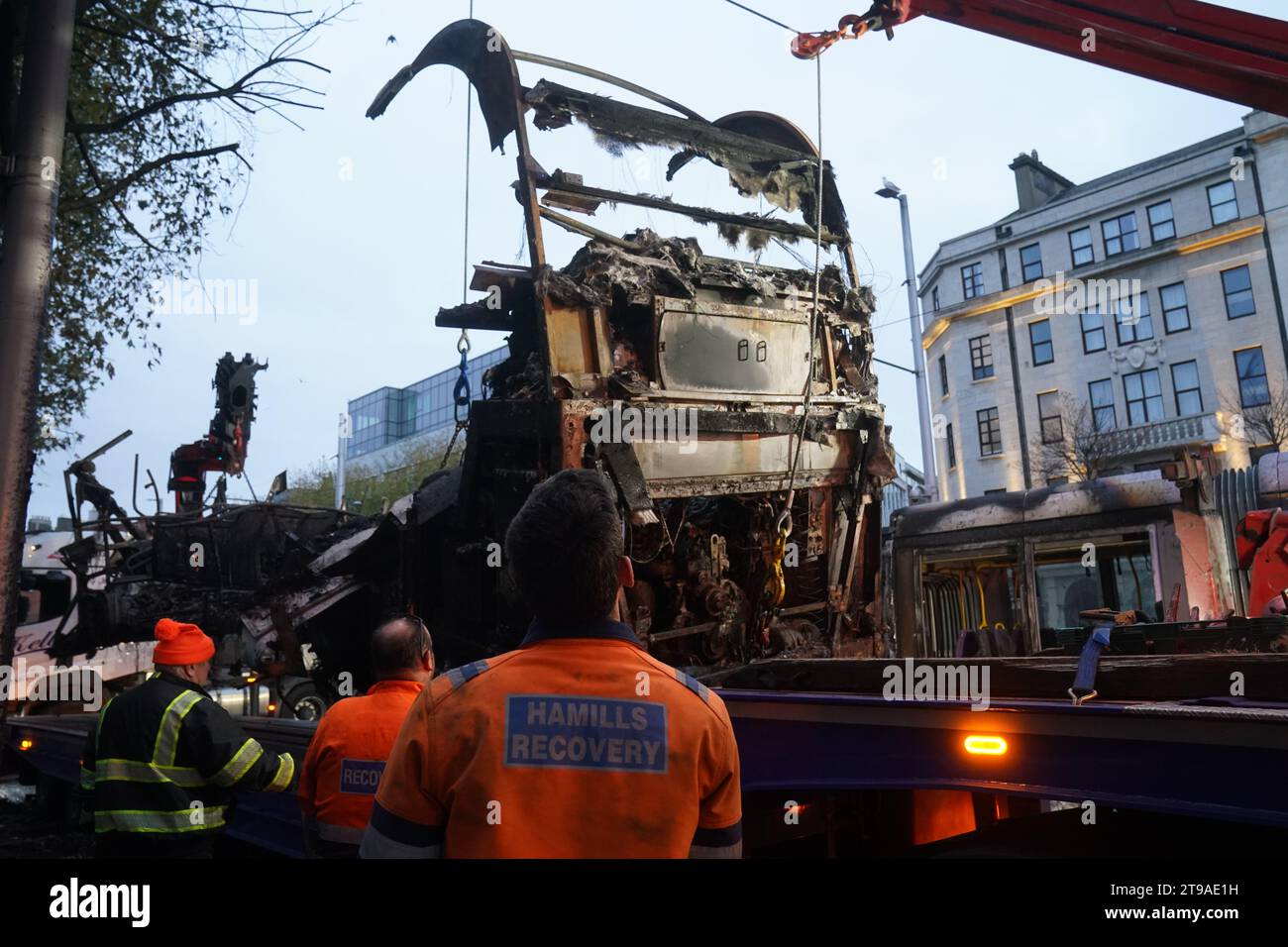 A burned out Luas is removed from O'Connell Street in Dublin, in the ...