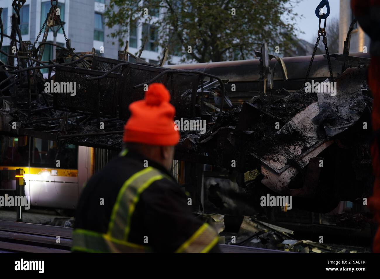 A burned out Luas is removed from O'Connell Street in Dublin, in the ...