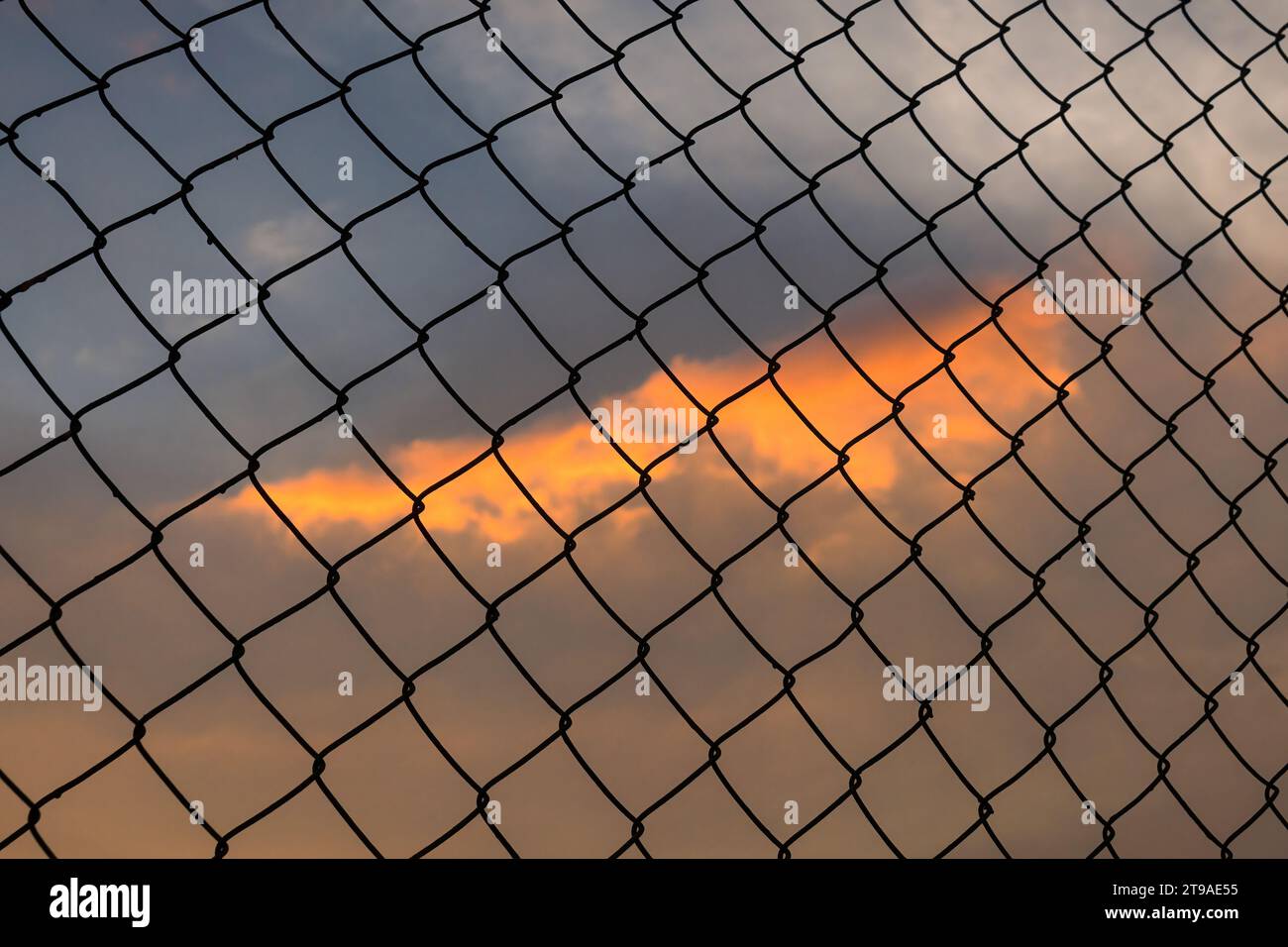 Witness the fusion of steel and sky as evening glow casts mesmerizing ...