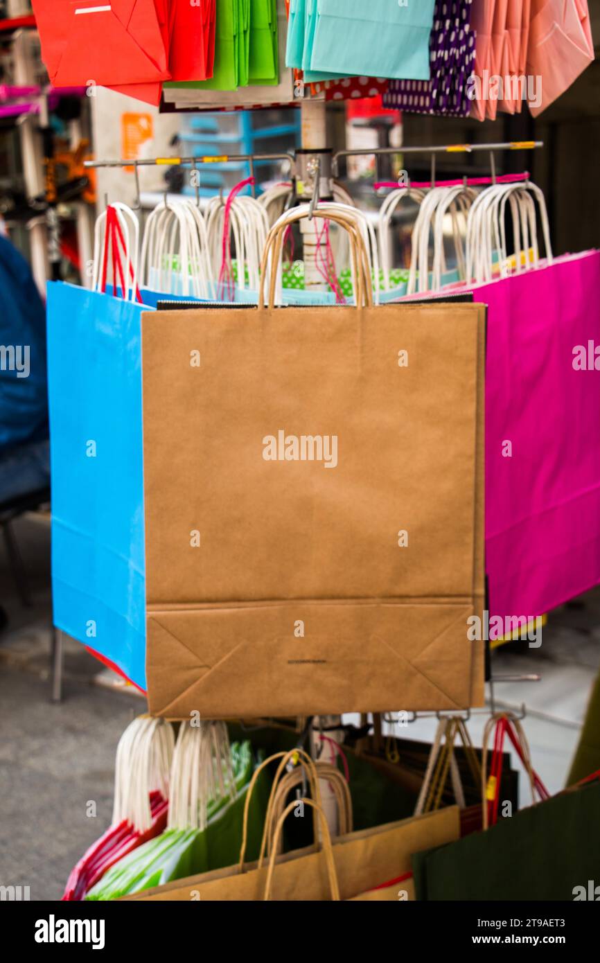 One simple color paper shopping bag in the market place Stock Photo - Alamy